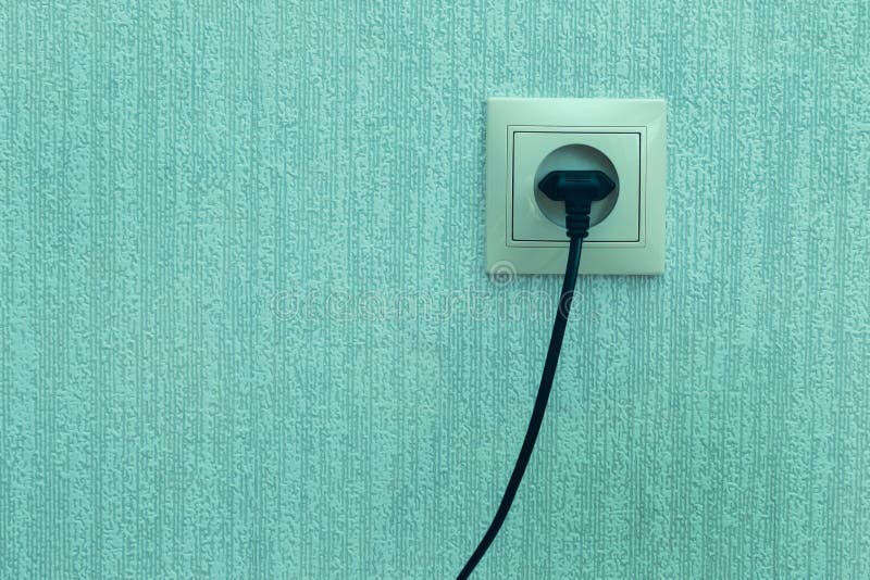 Socket with Plug in the Color on the Wall in Blue Wallpaper Stock Image ...