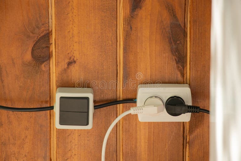 Socket and Switch on a Wooden Wall Outside, Plastic Sockets Stock Photo ...