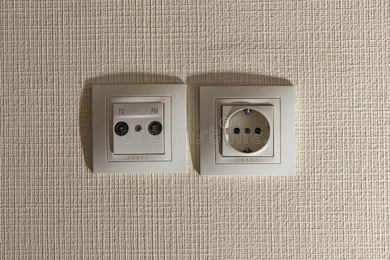 Socket and Socket for the TV Antenna Cable on the Beige Wall Stock ...