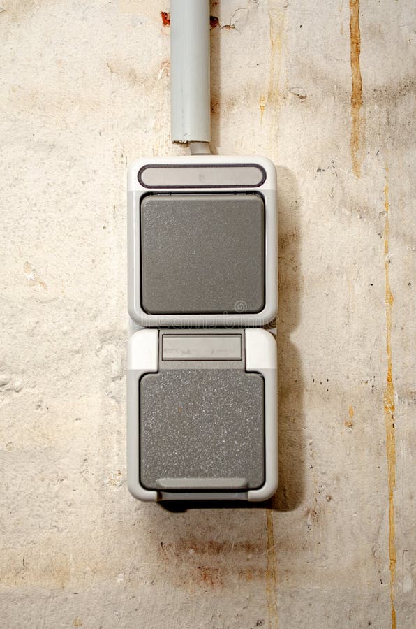 Sockets with a Protective Cover on the Wall with a Piece of Wire Stock ...