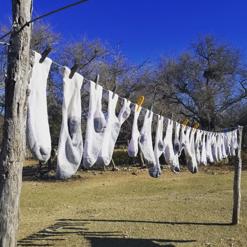 Socks on the laundry line stock image. Image of whimsical - 80913235