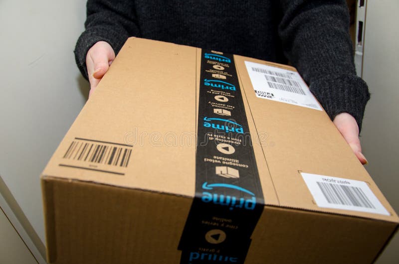 Woman receiving parcel editorial stock image. Image of female - 26884669