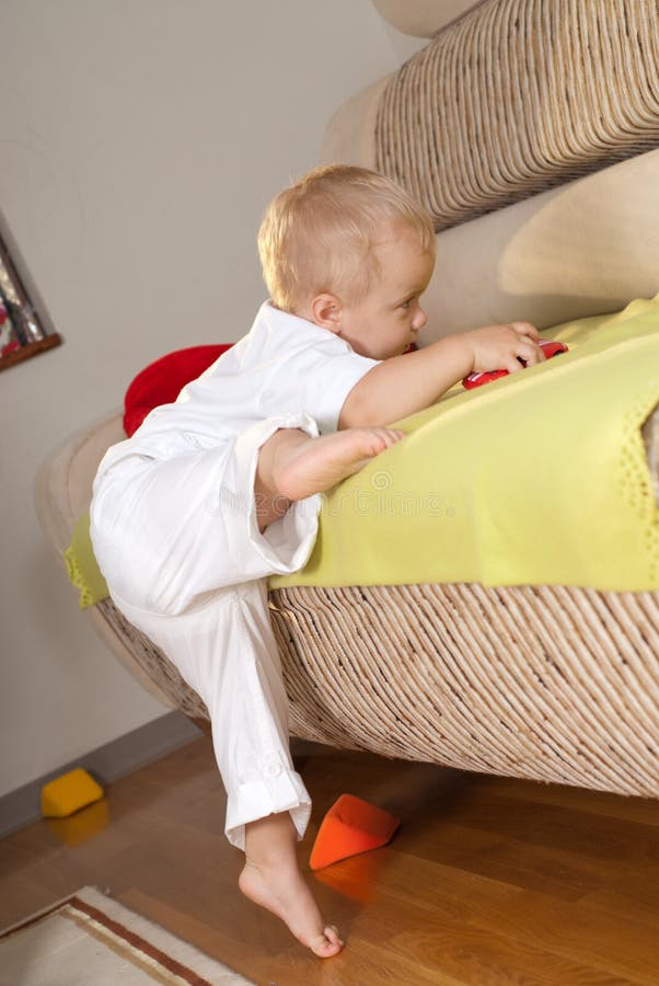 Sofa assault stock photo. Image of effort, cute, childhood - 11089410