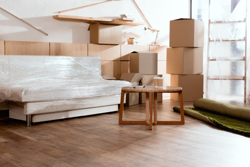 Sofa, Table, Rolled Carpet and Cardboard Boxes Stock Photo - Image of ...