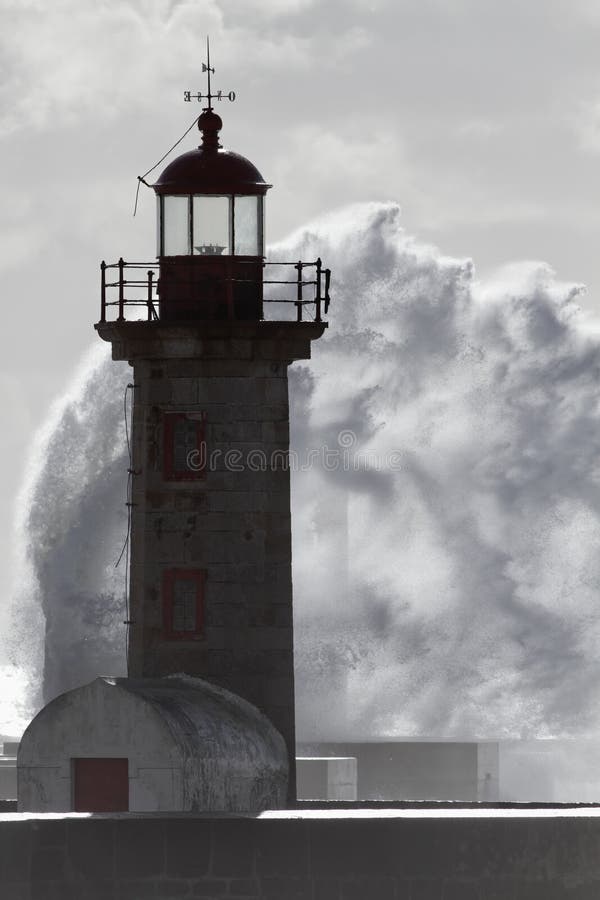 Soft Backlit Lighthouse and Wave Splash Stock Photo - Image of ...
