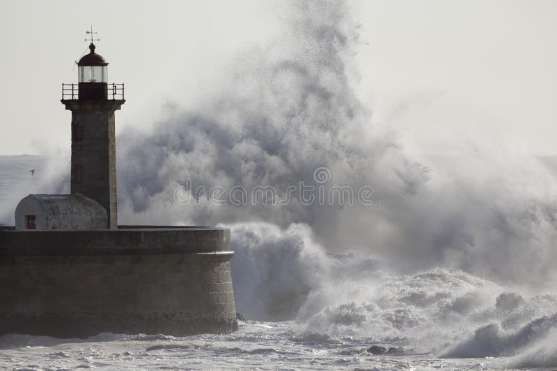 Soft Backlit Waves Over Old Lighthouse Stock Photo - Image of dramatic ...