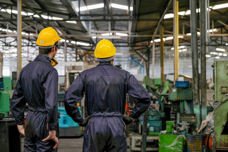 Soft Blur Image of the Back of Two Technician Men Stand and Look To ...