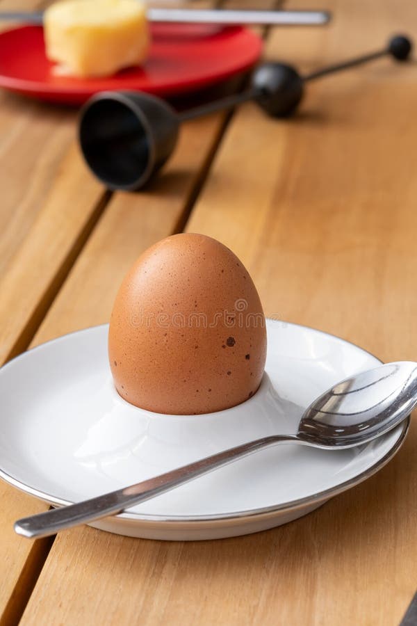 Soft Boiled Egg in Eggcup with Slice of Toasted Toast on Wooden Table ...