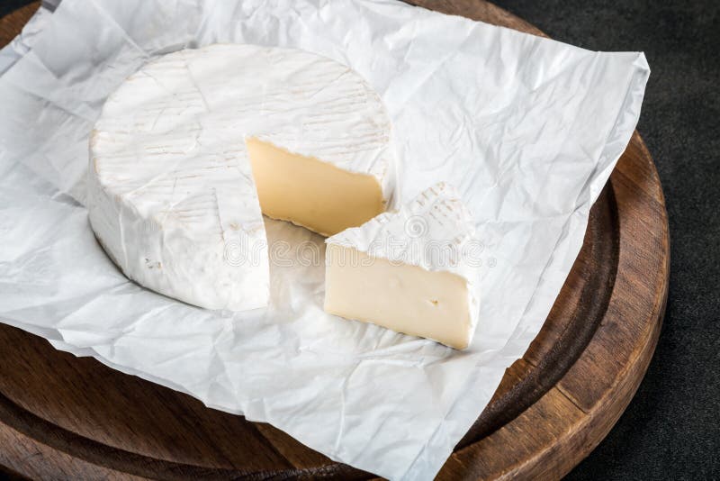 Soft Brie Cheese is on the Cutting Board Stock Photo - Image of product ...