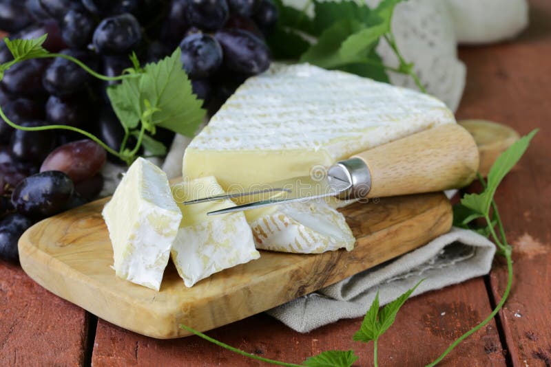 Soft Brie Cheese with Sweet Grapes Stock Image - Image of piece ...