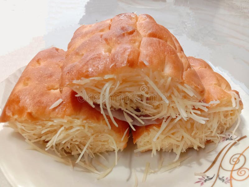 Soft and Delicious Bread with Slices of Cheese on the Front and Back ...