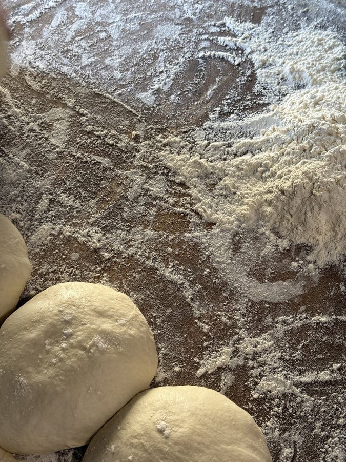 Soft Dough Balls Rest on a Flour-dusted Wooden Surface, Ready for ...