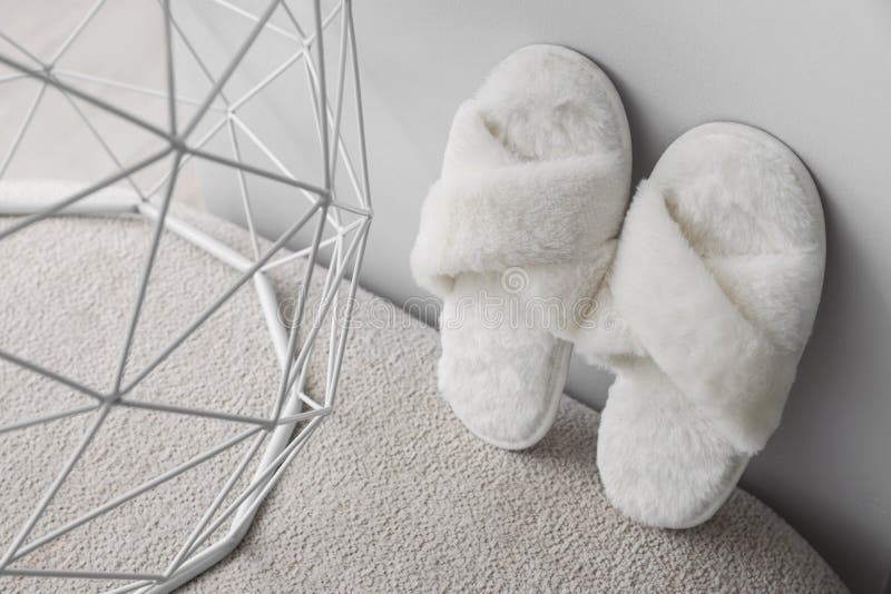 Soft Fluffy White Slippers Near Grey Wall Stock Image - Image of modern ...