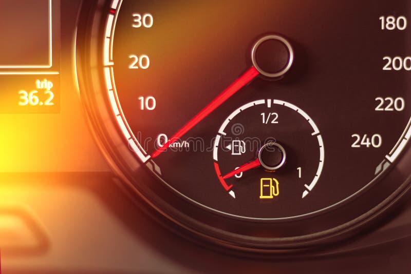 Soft Focus. Natural Light. the Dashboard. it is Lit, the Fuel Level ...