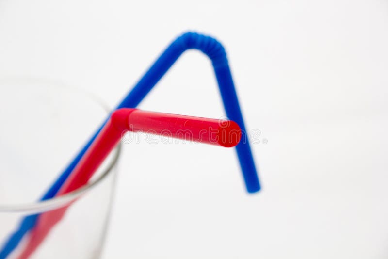 Soft Focus Of A Red Bendy Straw In A Glass With Blue Straw In The ...