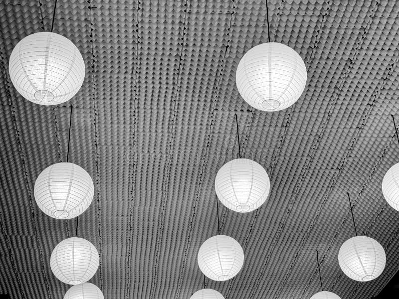 Soft Glowing Paper Lanterns Hang Elegantly from the Ceiling, Creating ...