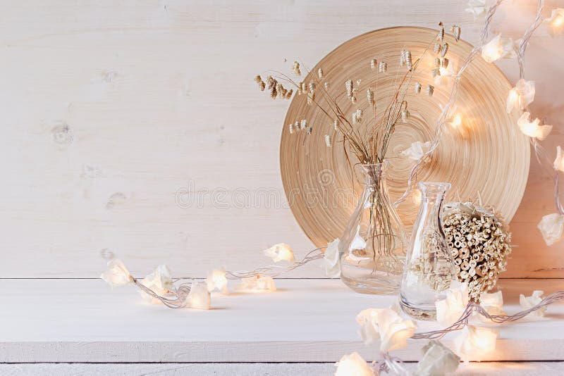 Soft Home Decor with Burning Lights on White Wooden Background. Stock ...