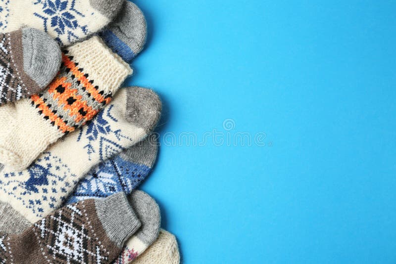 Soft Knitted Socks on Blue Background, Flat Lay with Space for Text ...