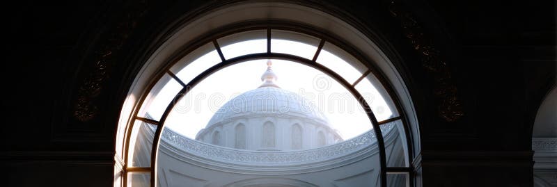 Dome Visible through Arched Window with Soft Light Illuminating Details ...