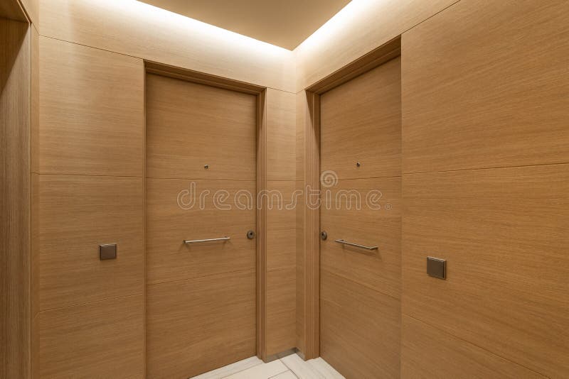 Soft Light from Niche Under Ceiling Illuminates Doors and Walls in ...
