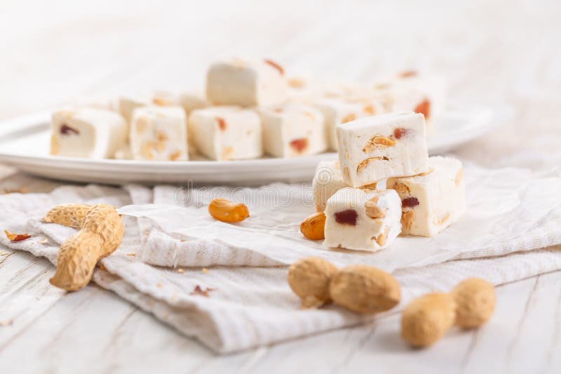 Soft Nougat with Peanuts on a Plate, Chewy Sweets with Nuts Stock Photo ...