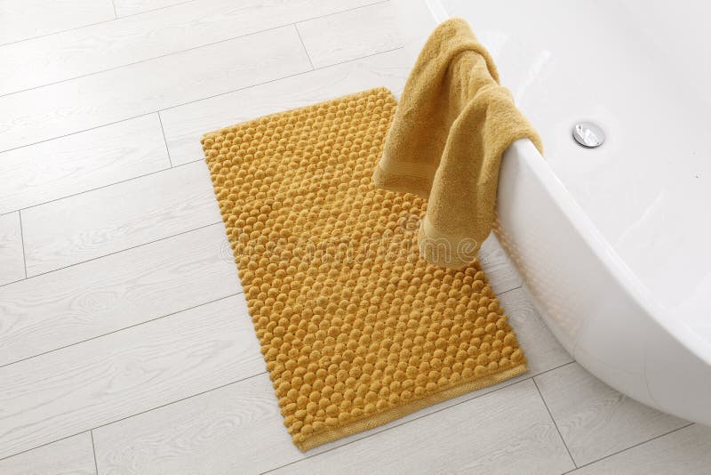Soft Orange Bath Mat on Floor in Bathroom Stock Photo - Image of foot ...