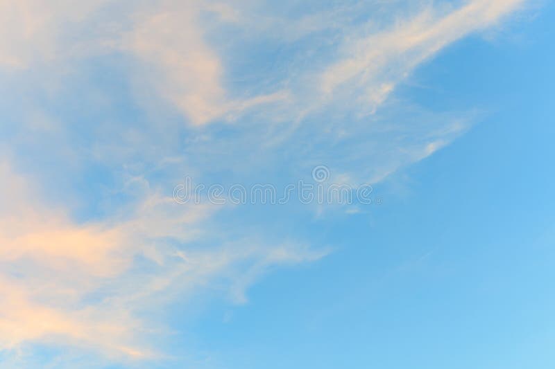 Soft Pastel Clouds in a Clear Blue Sky at Sunset Stock Image - Image of ...
