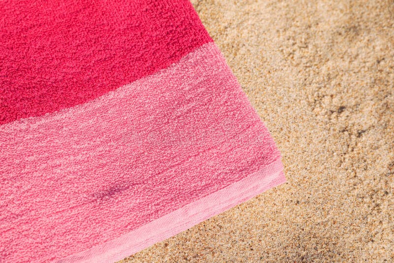 Soft Pink Beach Towel on Sand, Closeup. Space for Text Stock Photo ...