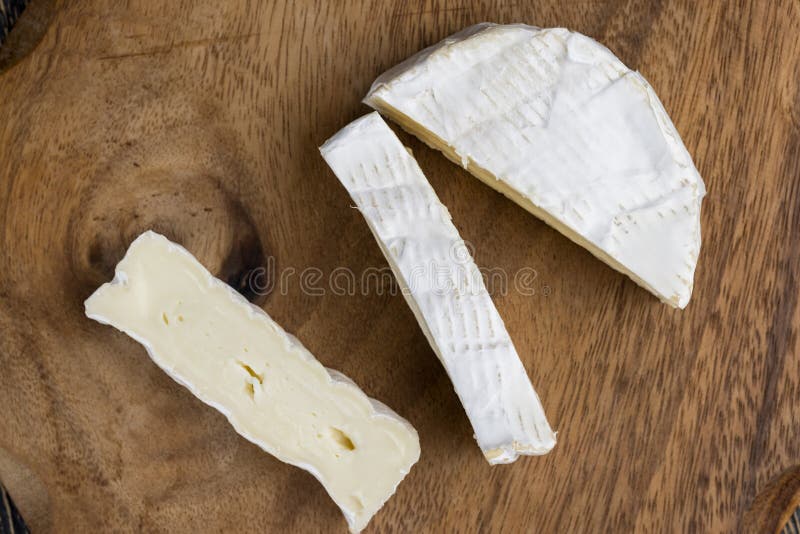 Soft Processed Cheese with White Mold on the Table Stock Photo - Image ...