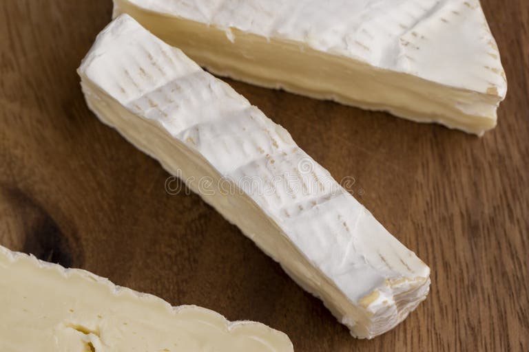 Soft Processed Cheese with White Mold on the Table Stock Photo - Image ...