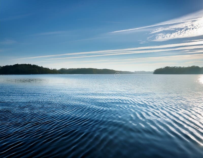 Soft Ripples on a Calm Lake Reflecting Light and Creating Textured ...