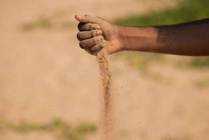 Soft Grains of Sand Flowing through Hand Stock Photo - Image of evening ...