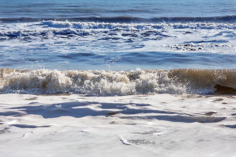 A Soft Sea Wave Rolls Onto the Sand of the Beach. Seascape Waves on the ...