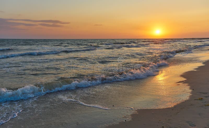 Soft Sea Waves and Bubbles on the Beach with Sunset Sky Stock Image ...