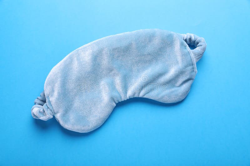 Soft Sleep Mask on Light Blue Background, Top View Stock Image - Image ...