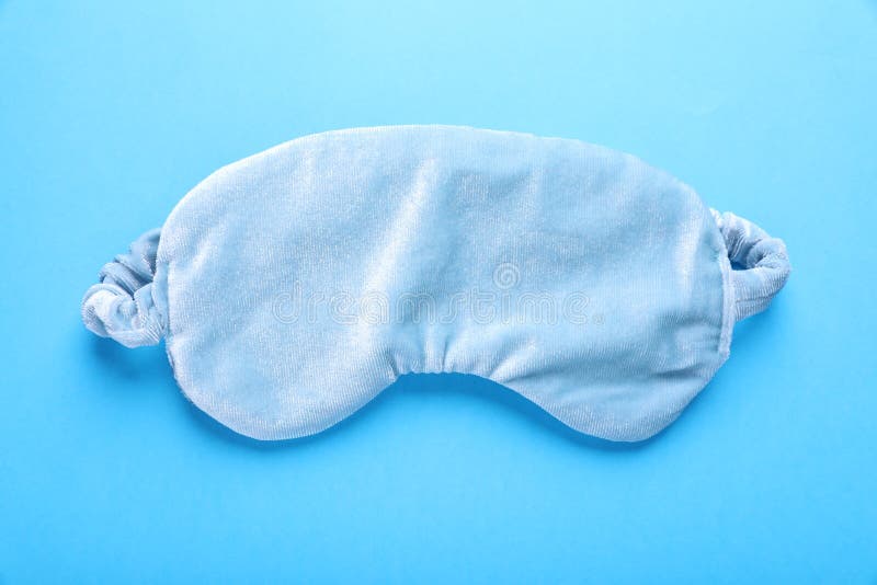 Soft Sleep Mask on Light Blue Background, Top View Stock Image - Image ...