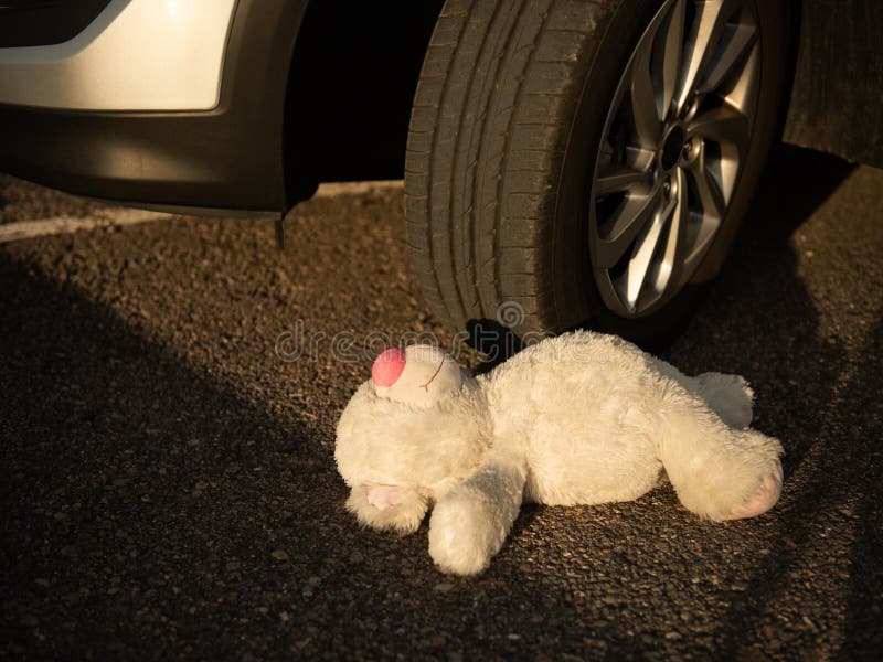 Soft Toy Bear in the Blood Under the Car Wheels Stock Photo - Image of ...