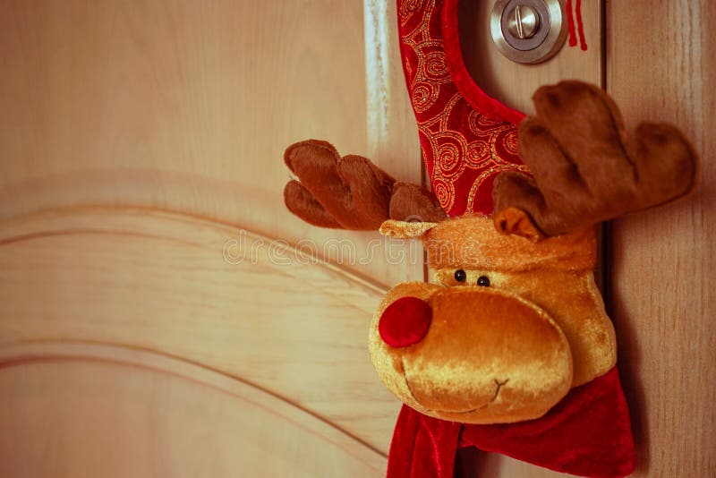 Soft Toy Beer with Horns Hang on the Door Handle Stock Image - Image of ...
