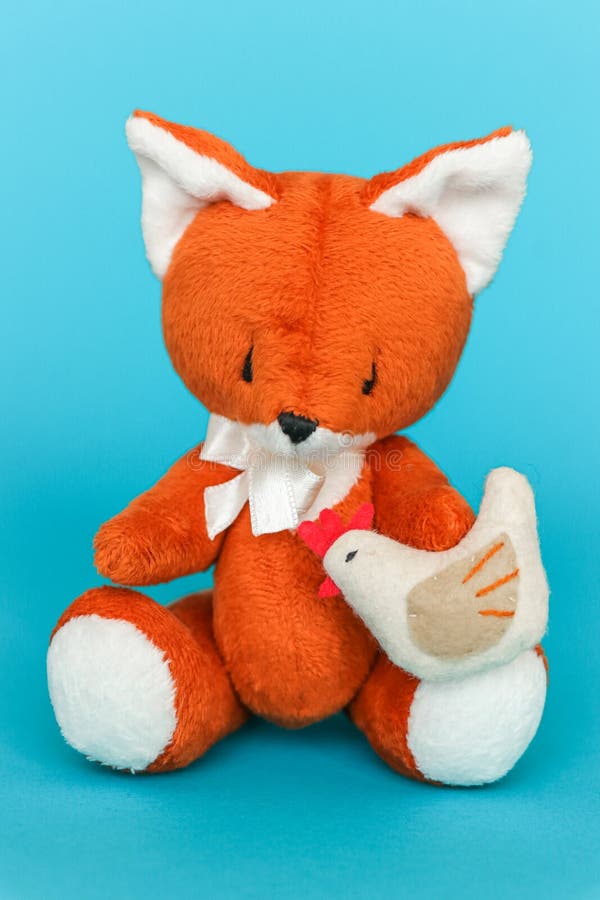 Soft Toy Ginger Fox with Chicken on a Blue Background Stock Image ...