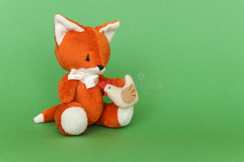 Soft Toy Ginger Fox with Chicken on a Green Background Stock Image ...