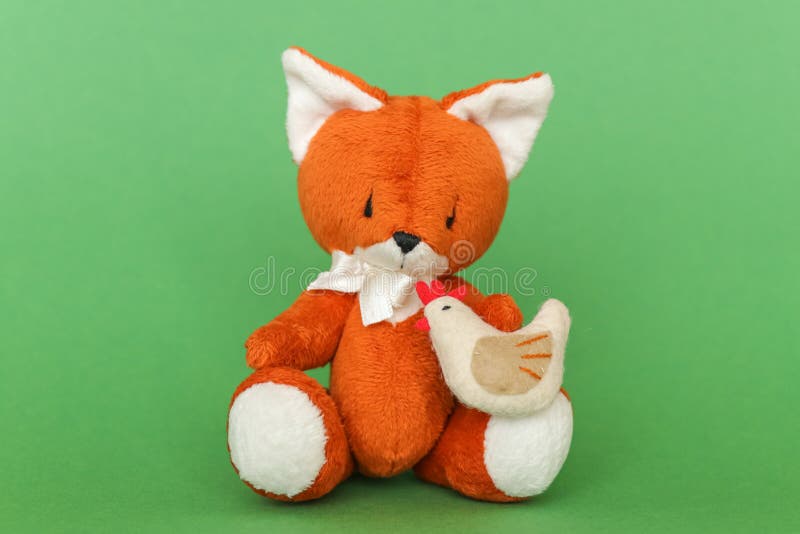 Soft Toy Ginger Fox with Chicken on a Green Background Stock Photo ...