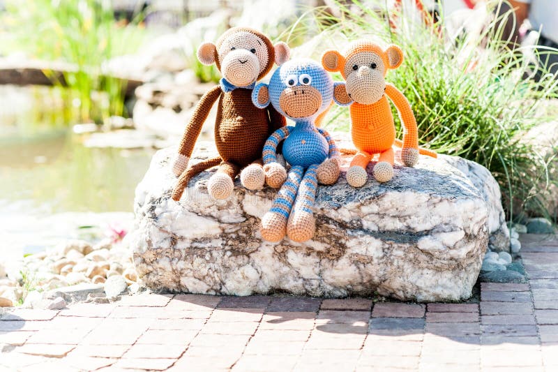 Soft toys - three monkeys stock image. Image of park - 60310035