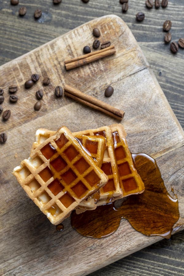 Soft Waffles with Natural Bee Honey on a Serving Board Stock Photo ...
