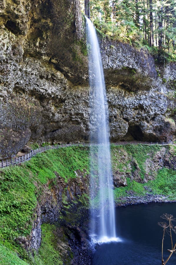 Soft Waterfall Cascading Onto Blue Azure Water Stock Photo - Image of ...