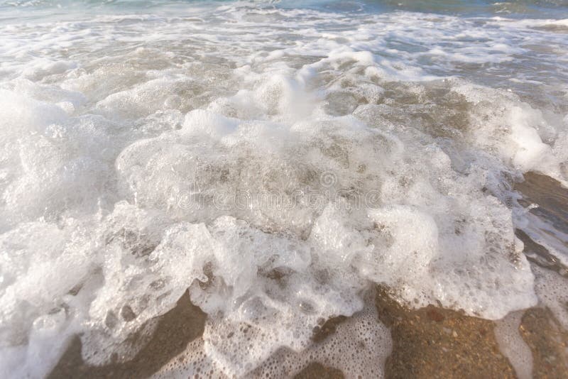 Soft wave on the beach. stock photo. Image of shiny - 130445338