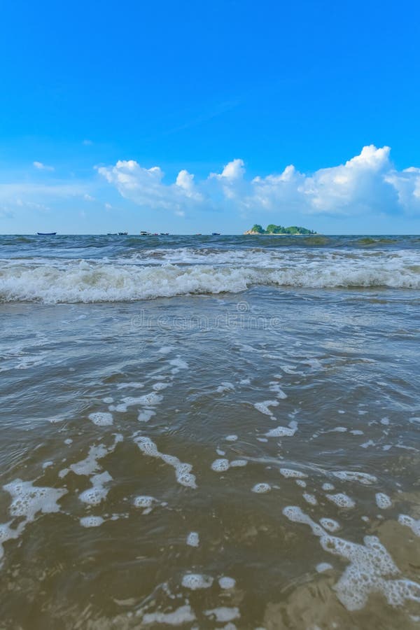 Soft Wave on Beach with White Clouds in the Sky Vertical Composition ...