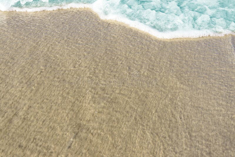 Soft Wave of Blue Ocean on Sandy Beach. Background / Sand and Wave at ...