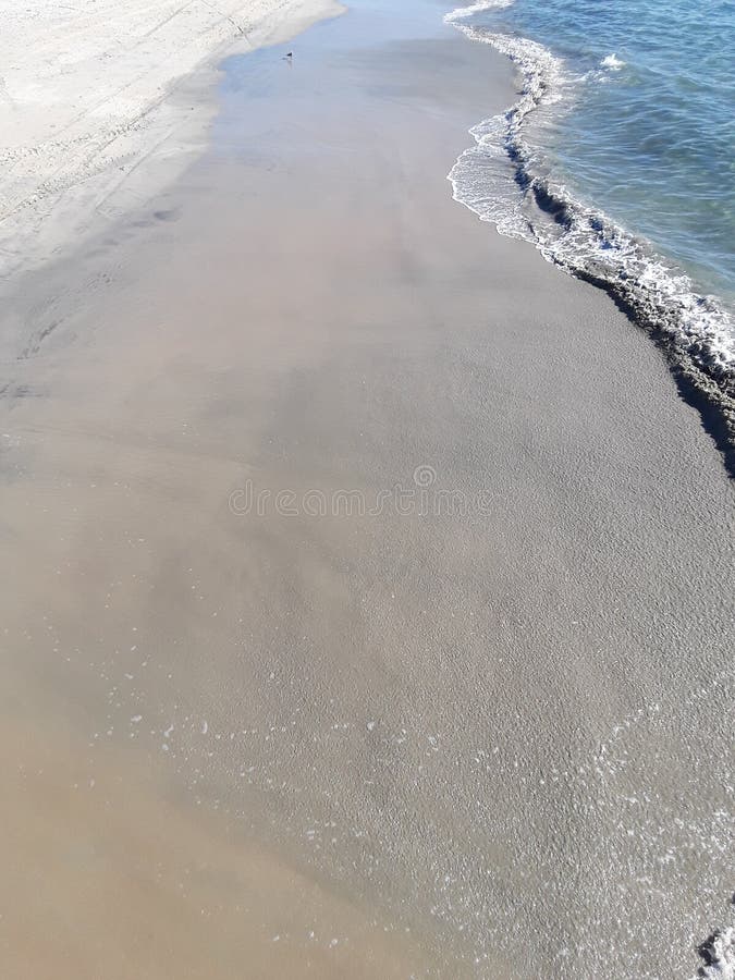 Soft Wave of Blue Ocean on Sandy Beach. Background. Selective Focus ...