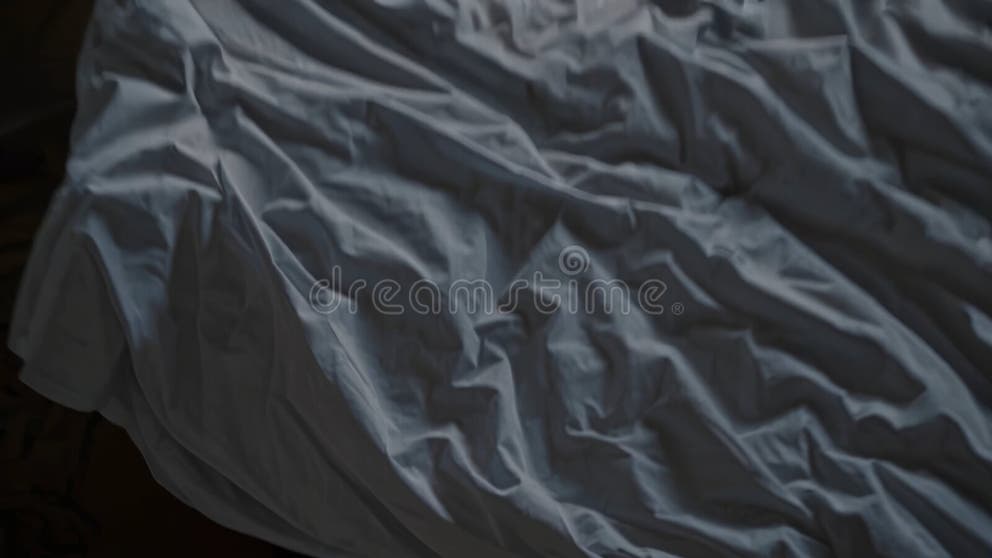 Soft White Bedsheets Shifting Under Changing Light, Casting Dynamic ...