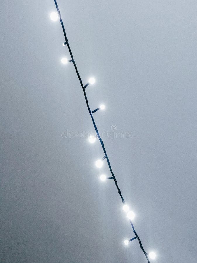 Soft White String Lights Hang from the Ceiling, Casting a Gentle Glow ...